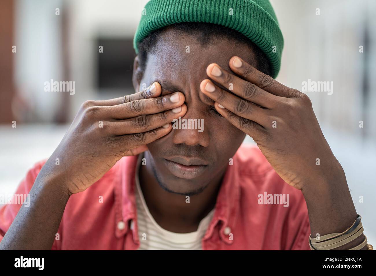 Fatigued black man feel dizzy from overwork lack of sleep eye strain ...