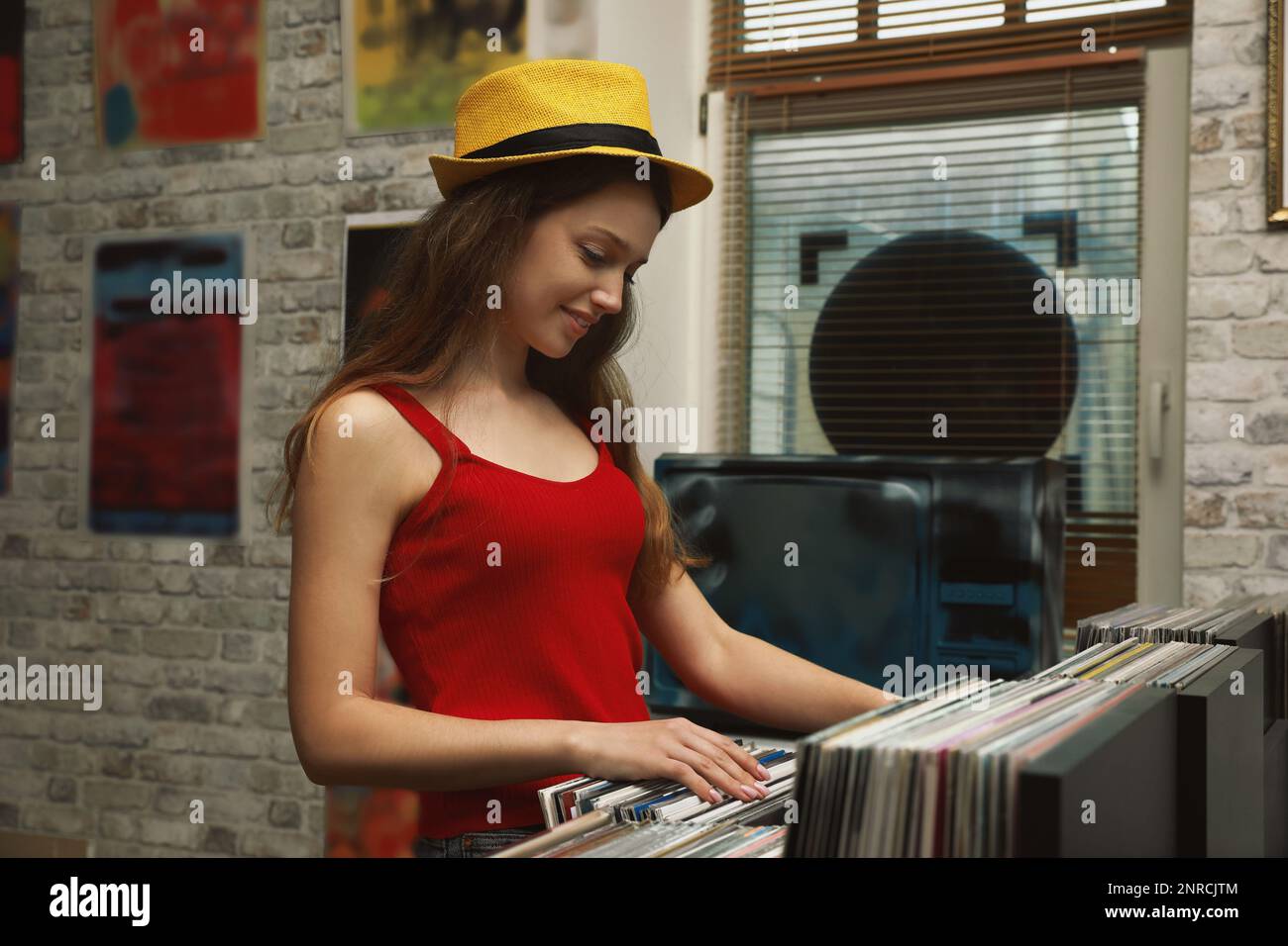Woman browsing vintage records hi-res stock photography and images - Alamy