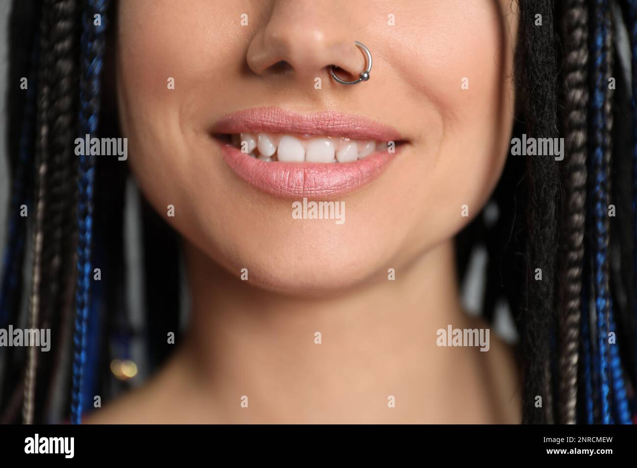 Young woman with nose piercing and dreadlocks, closeup Stock Photo - Alamy
