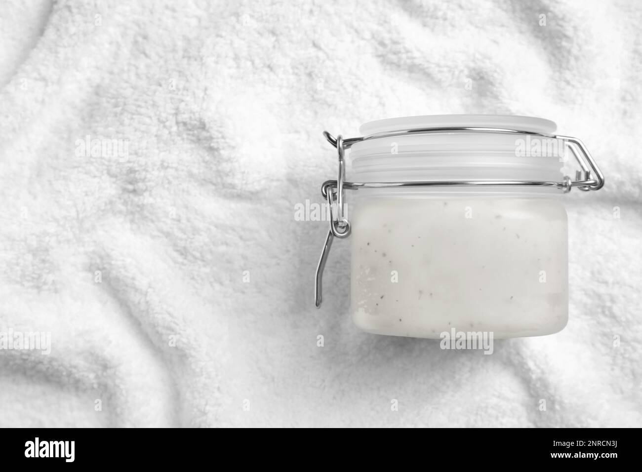 Jar of salt scrub on white towel, top view. Space for text Stock Photo ...