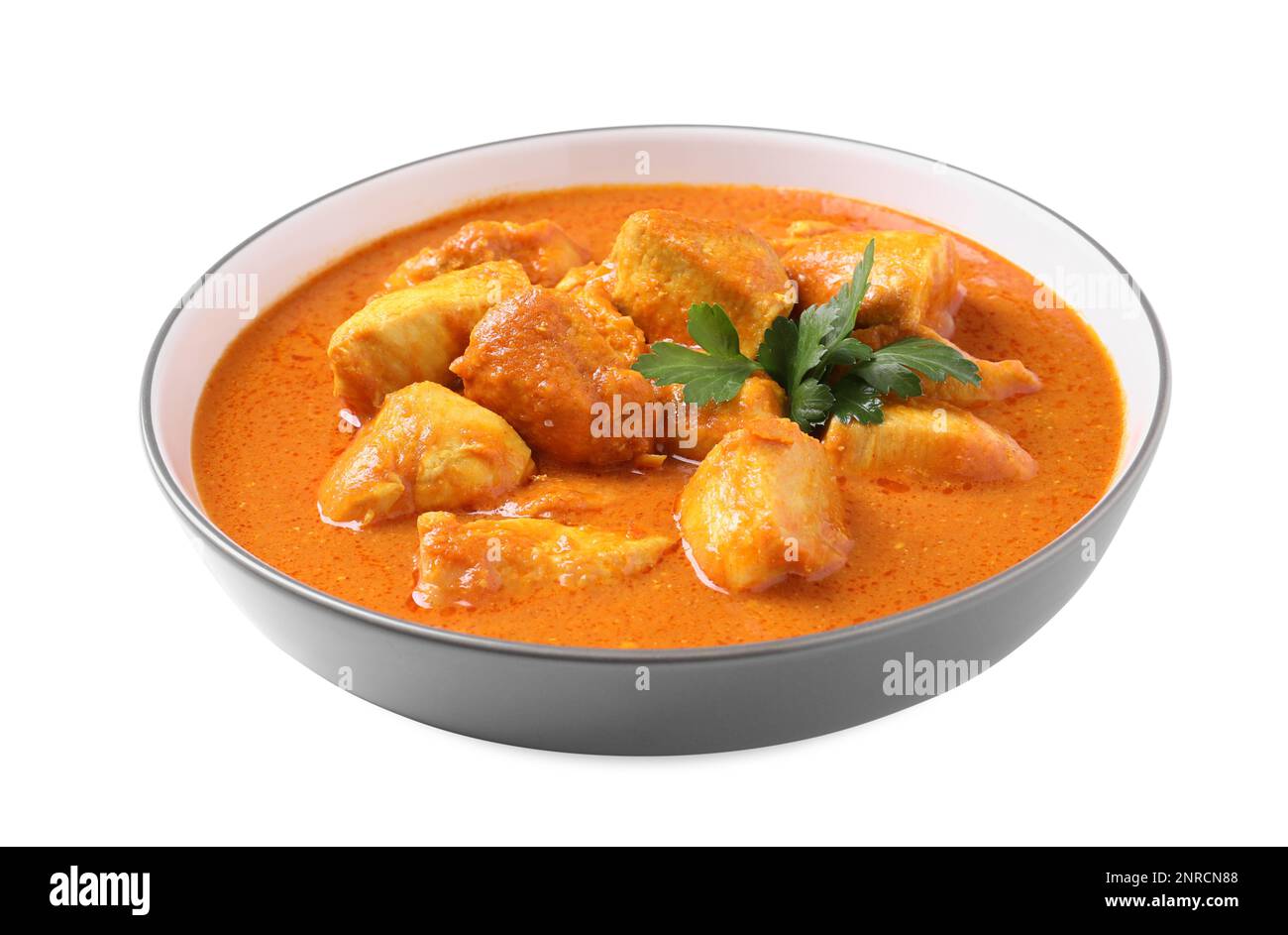 Bowl of delicious chicken curry on white background Stock Photo - Alamy