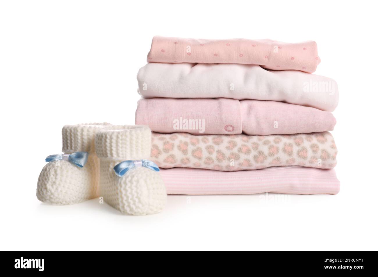 Stack of baby girl's clothes and booties on white background Stock ...
