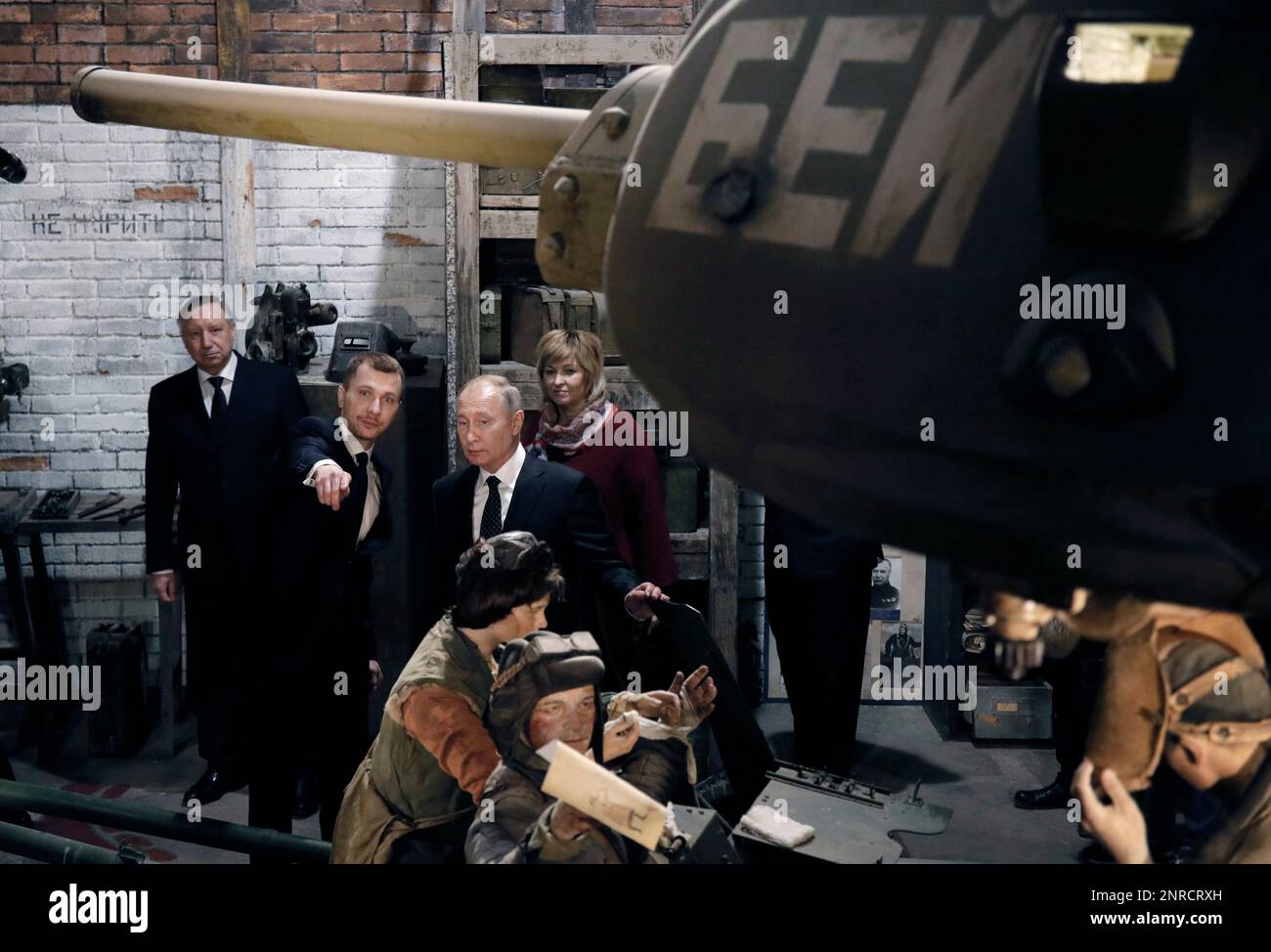 Russian President Vladimir Putin, centre, views a scene depicting an ...