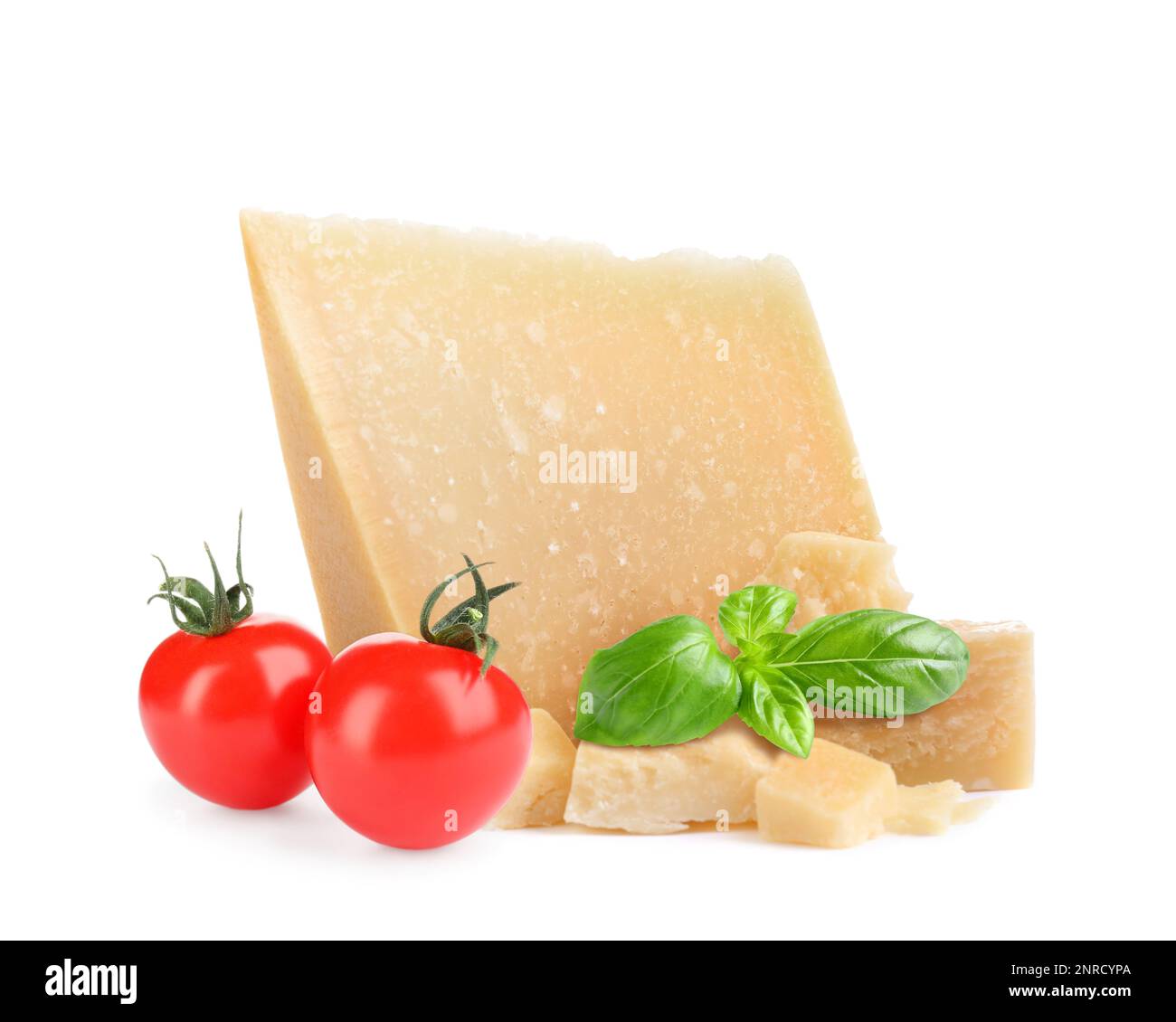 Delicious parmesan cheese, cherry tomatoes and basil on white ...