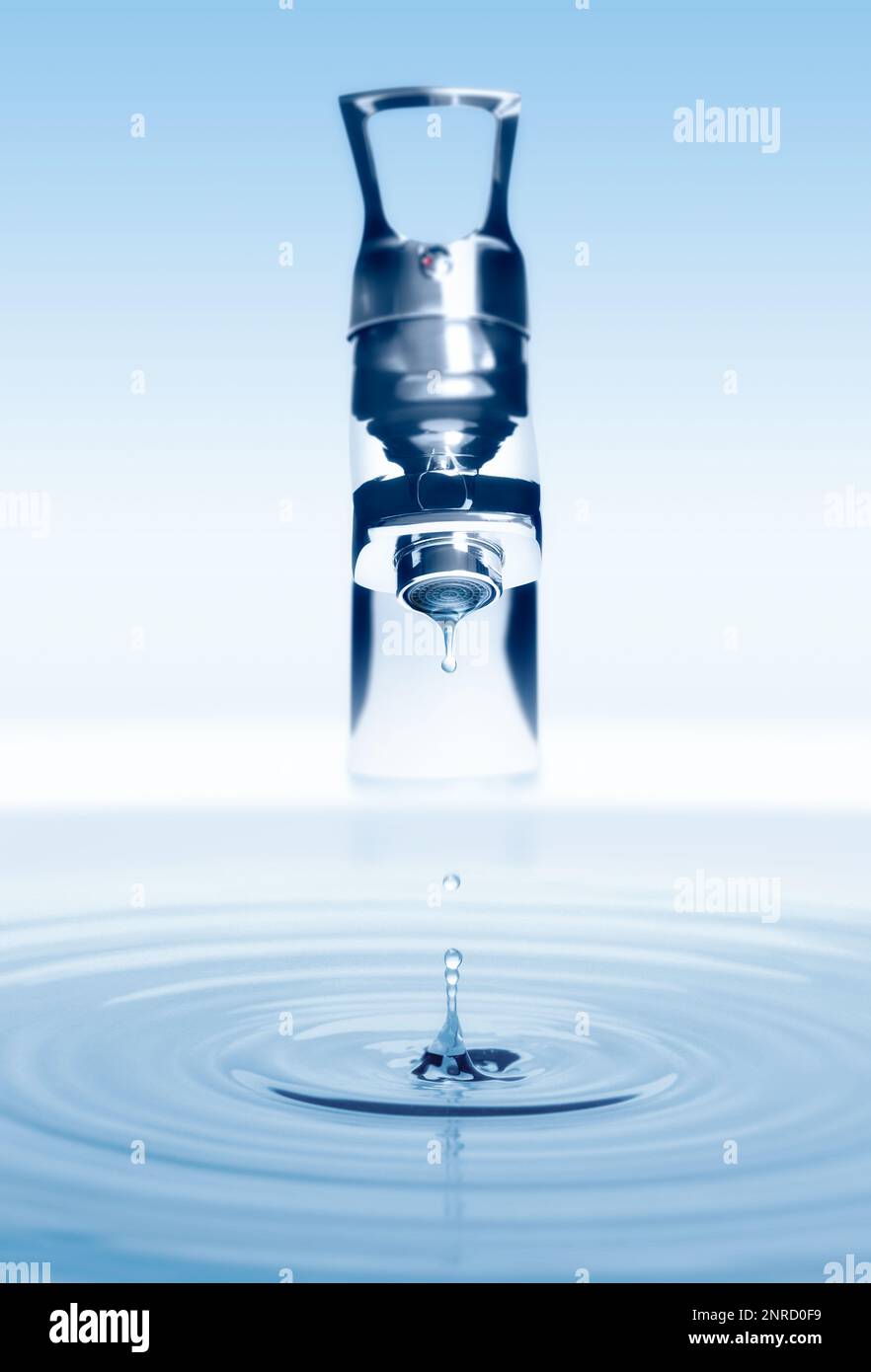 Water dripping from tap with splash on light background Stock Photo - Alamy