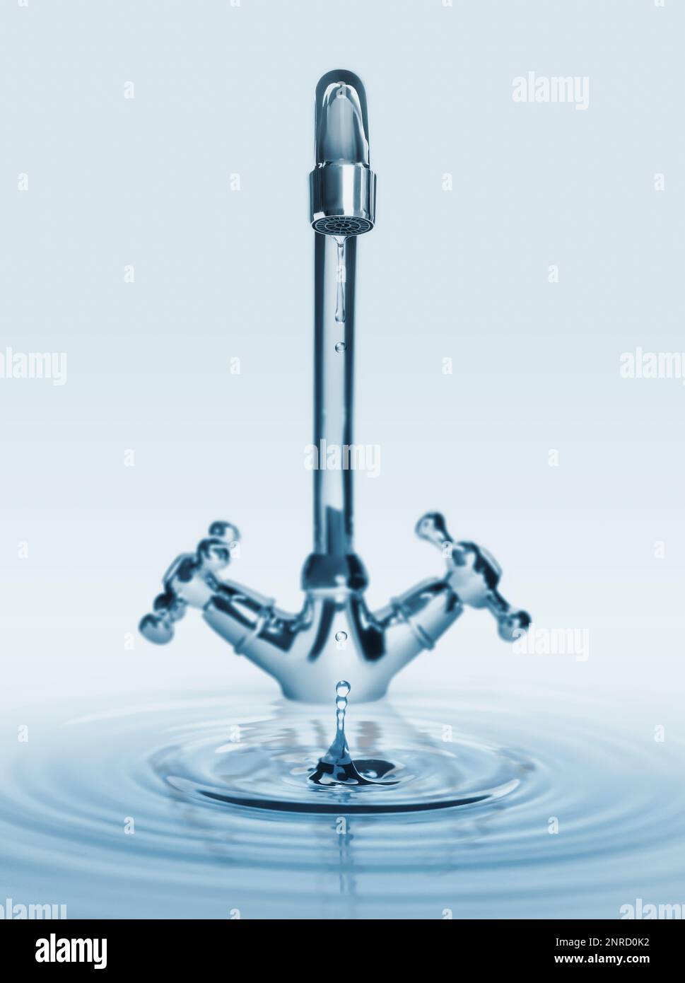 Water dripping from tap with splash on light background Stock Photo - Alamy