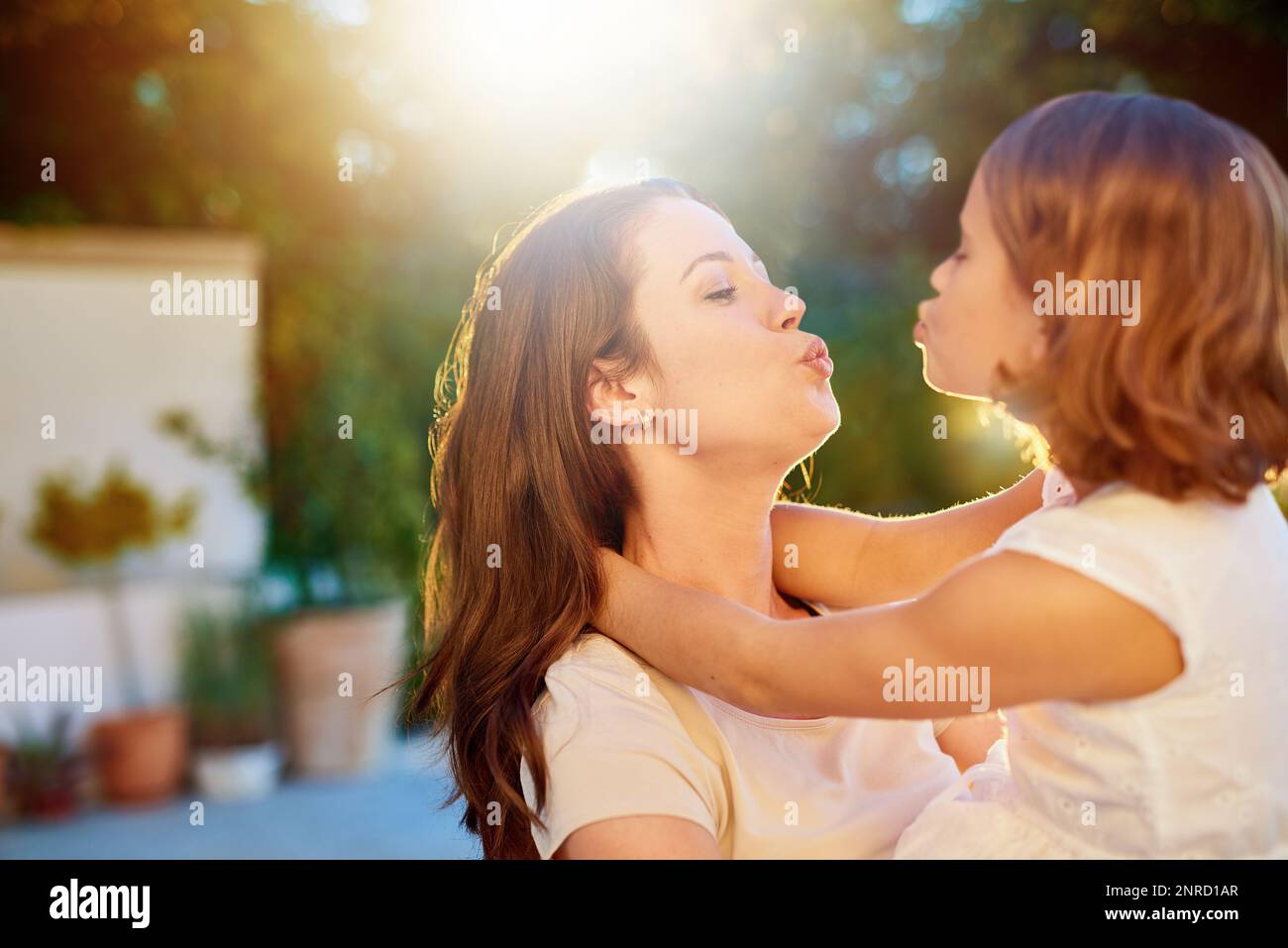 Kissy face. a mother and daughter spending quality time together Stock ...