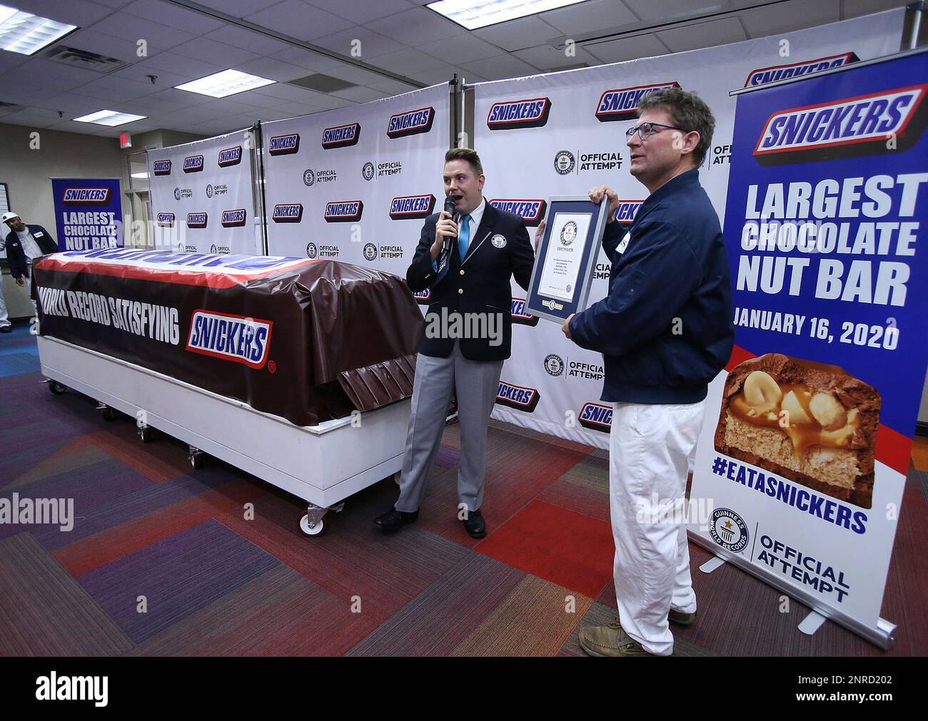 A Guinness world record representative presents Rudd Engbers, right ...