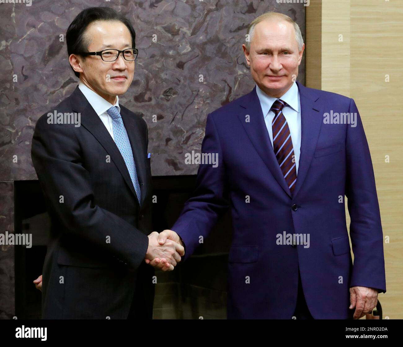 Russian President Vladimir Putin, right, and Japanese head of the ...