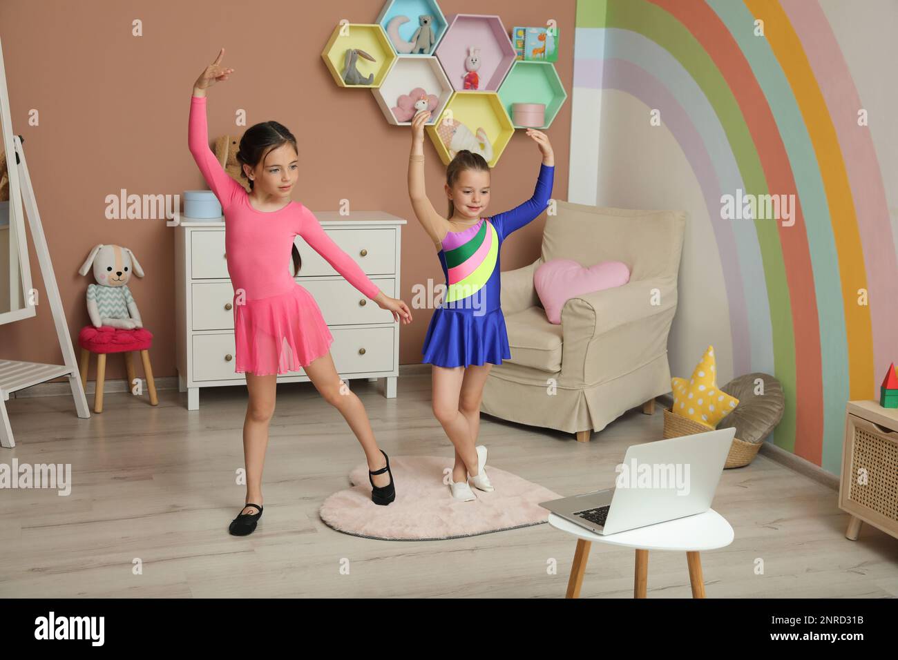 Cute little girls taking online dance class at home Stock Photo - Alamy
