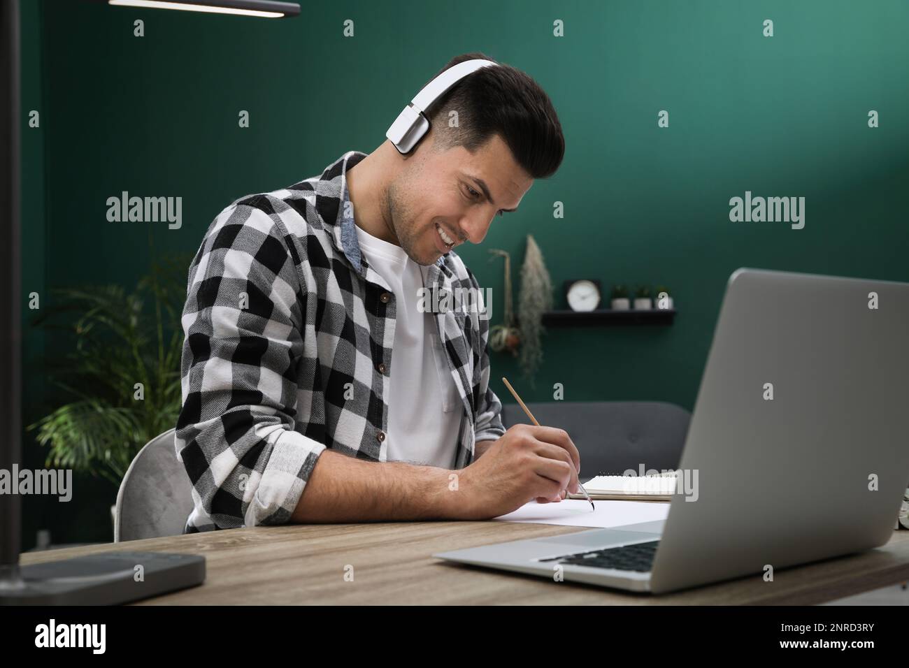 Man drawing with paints at online lesson indoors. Distance learning ...