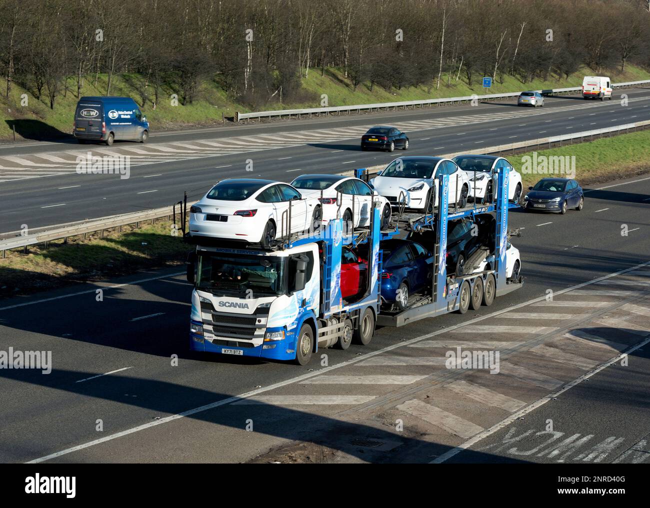 A Mobile Services transporter lorry carrying new Tesla cars on the M40 ...