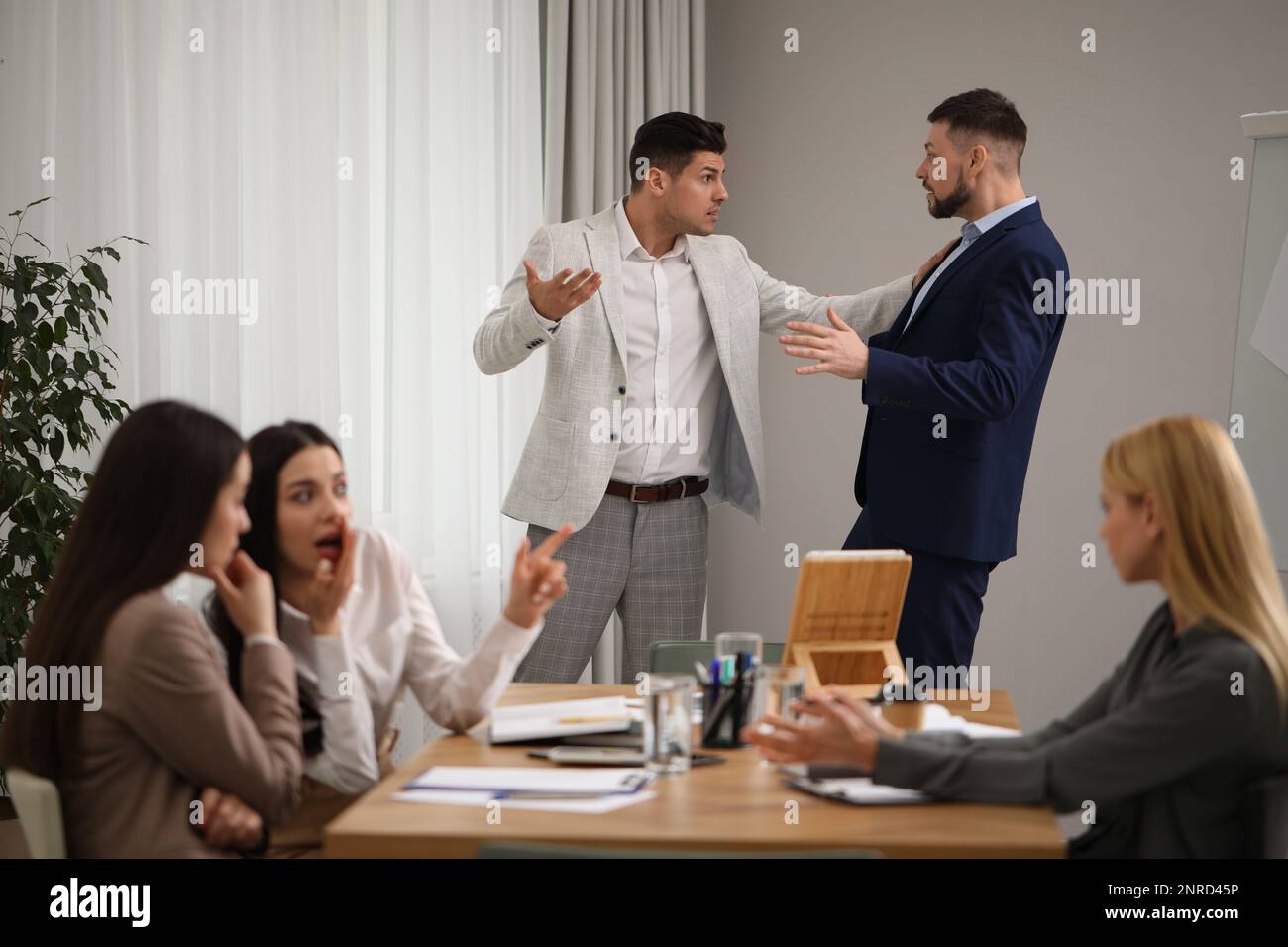 Angry coworkers quarreling at workplace in office Stock Photo - Alamy