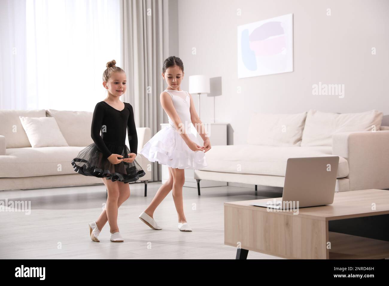 Cute little girls taking online dance class at home Stock Photo - Alamy
