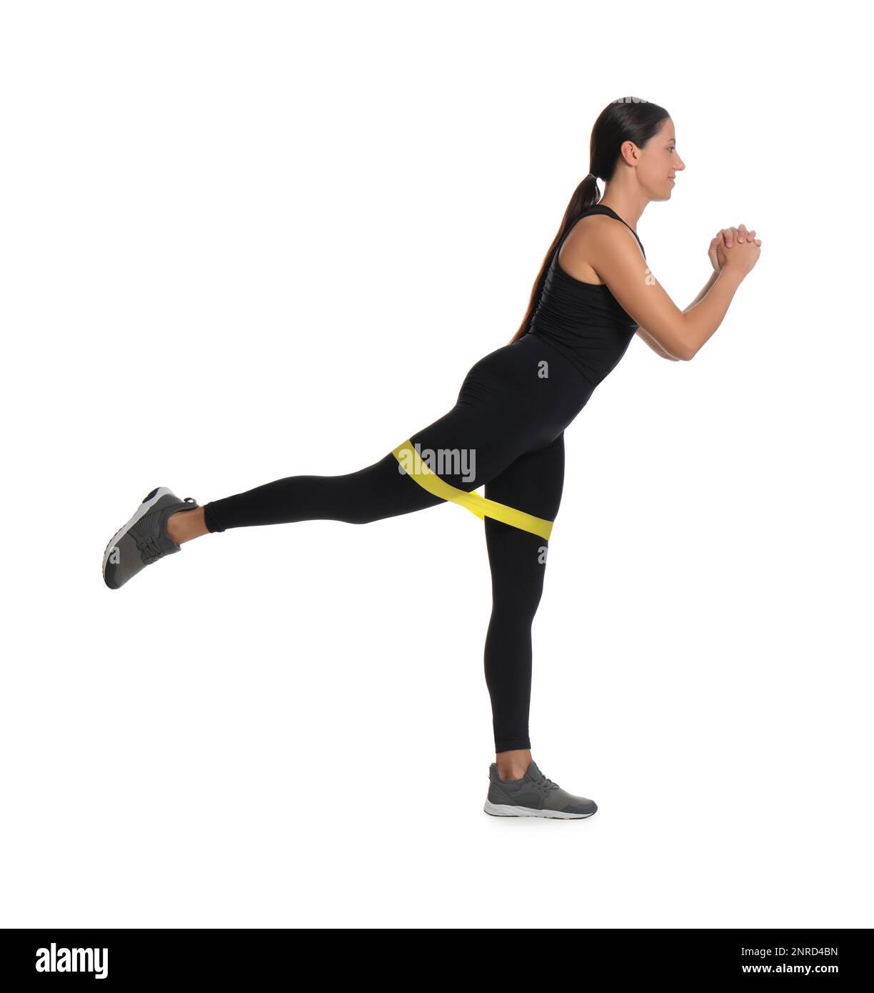 Woman doing sportive exercise with fitness elastic band on white ...
