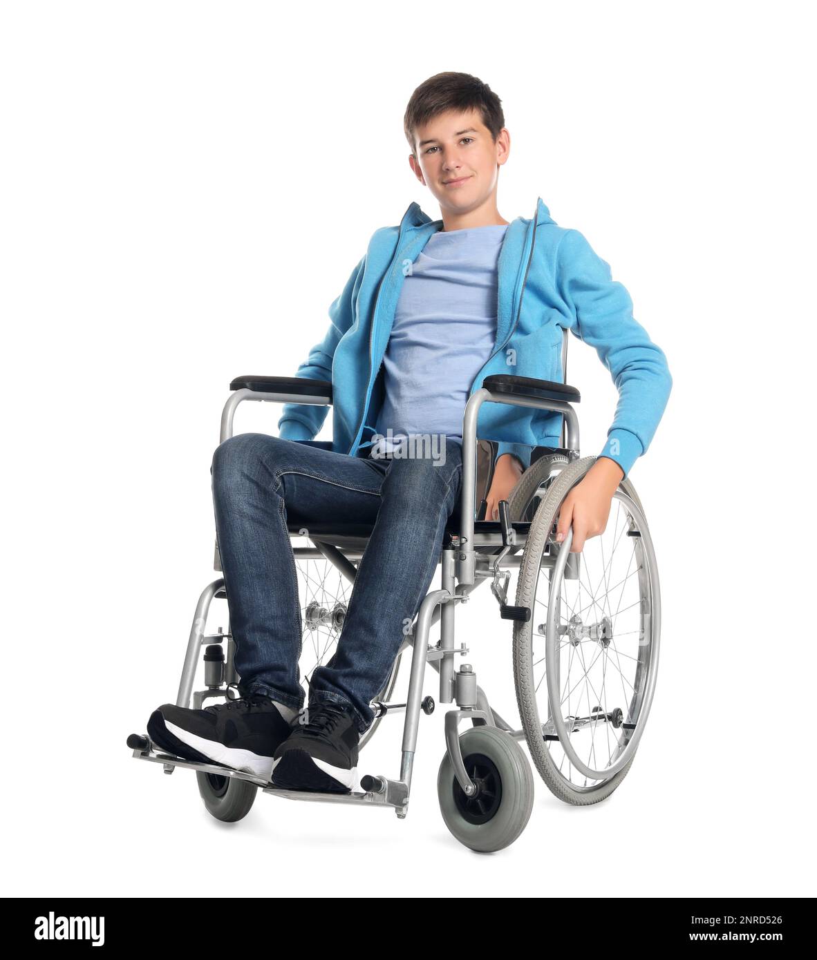 Teenage boy in wheelchair on white background Stock Photo - Alamy