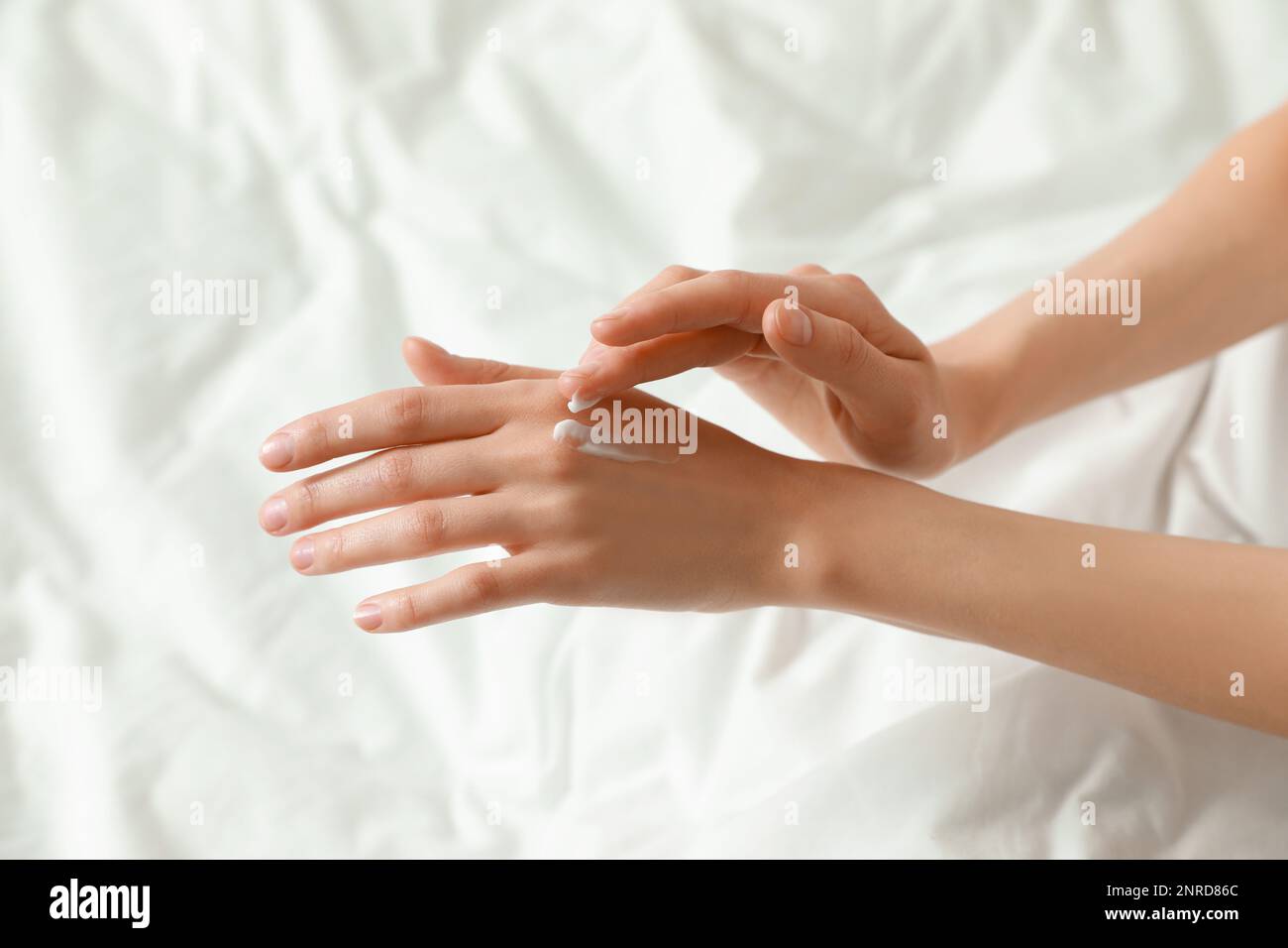 Woman using moisturizing cream hands hi-res stock photography and ...