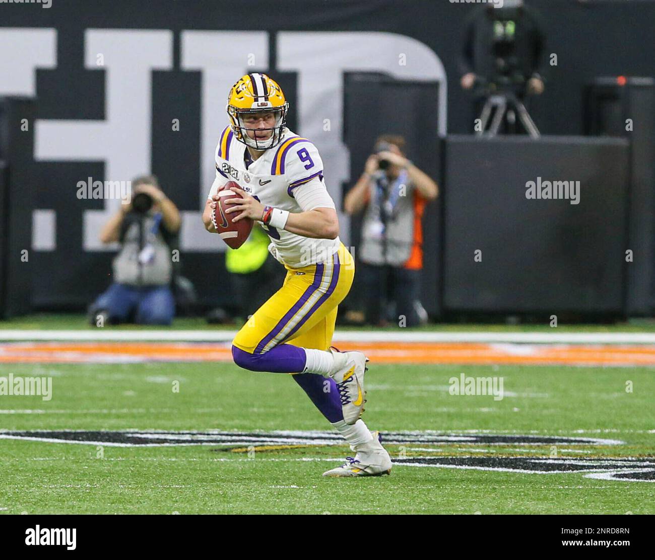 January 13, 2020: LSU quarterback Joe Burrow (9) rolls out of the ...