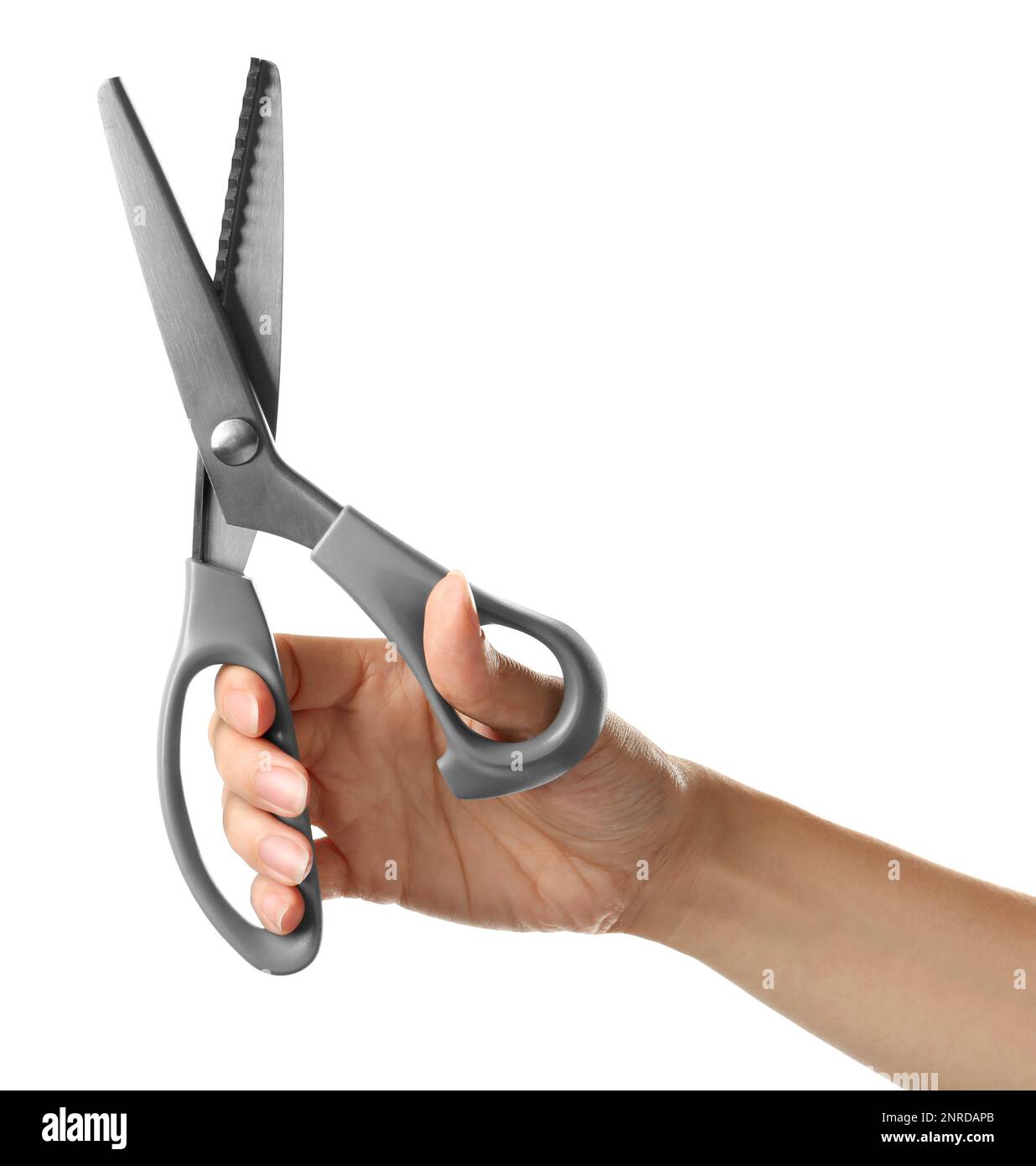Hand holding big scissors making hi-res stock photography and images ...