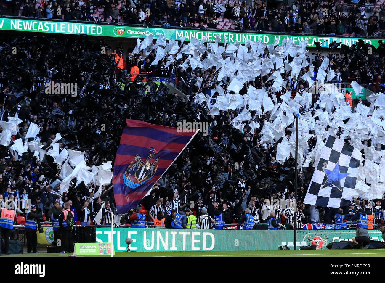 London, UK. 26th Feb, 2023. Newcastle United fans wave flags prior to ...