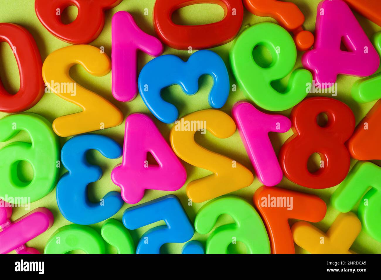 Colorful magnetic numbers on light green background, flat lay Stock ...
