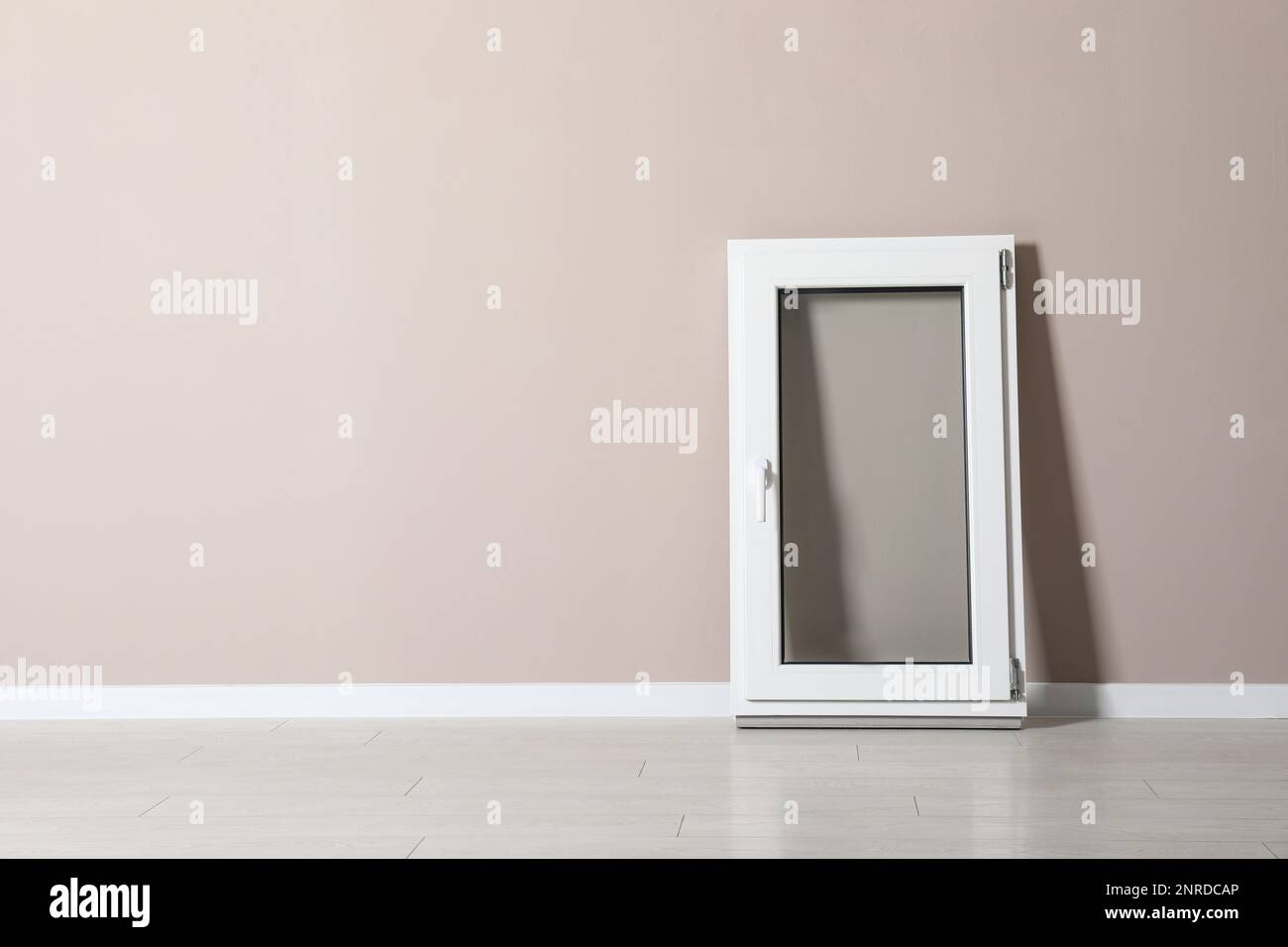 Modern single casement window near beige wall indoors, space for text ...