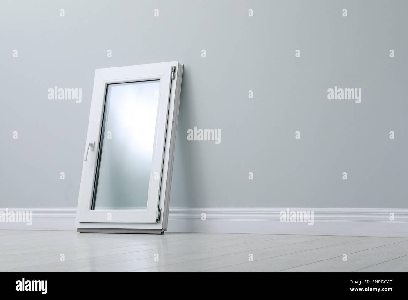 Modern single casement window near light grey wall indoors, space for ...