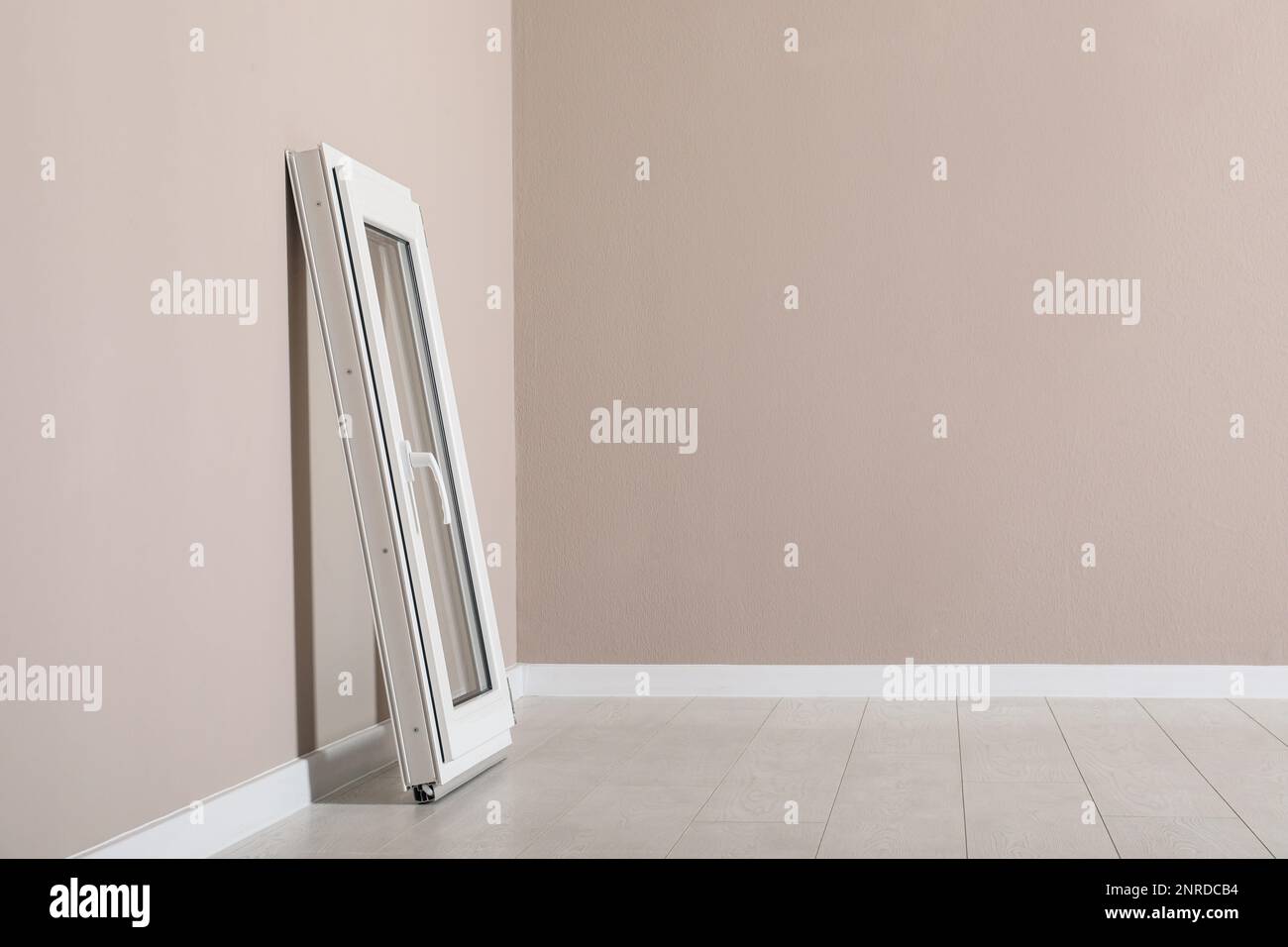 Modern single casement window near beige wall indoors, space for text ...