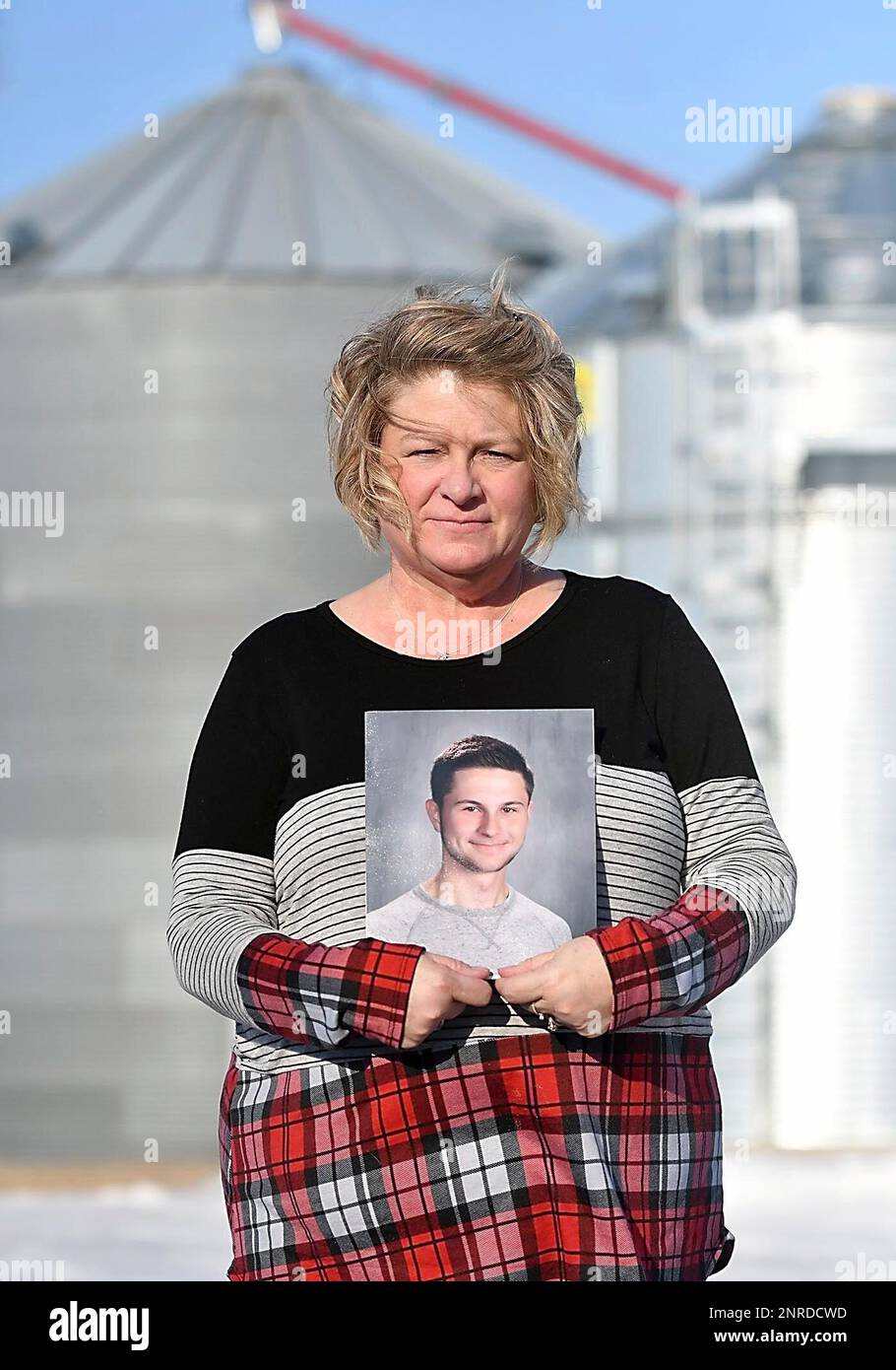 Michele Gran, shown here holding a photo of her 18-year-old son, Landon ...
