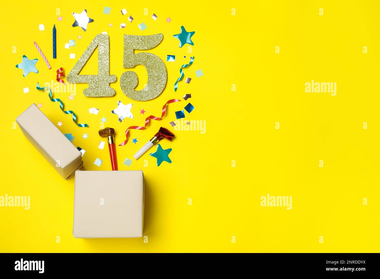 Flat lay composition with decor and numbers on yellow background, space ...