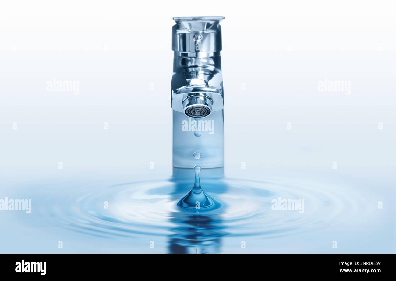 Water dripping from tap with splash on light background Stock Photo - Alamy