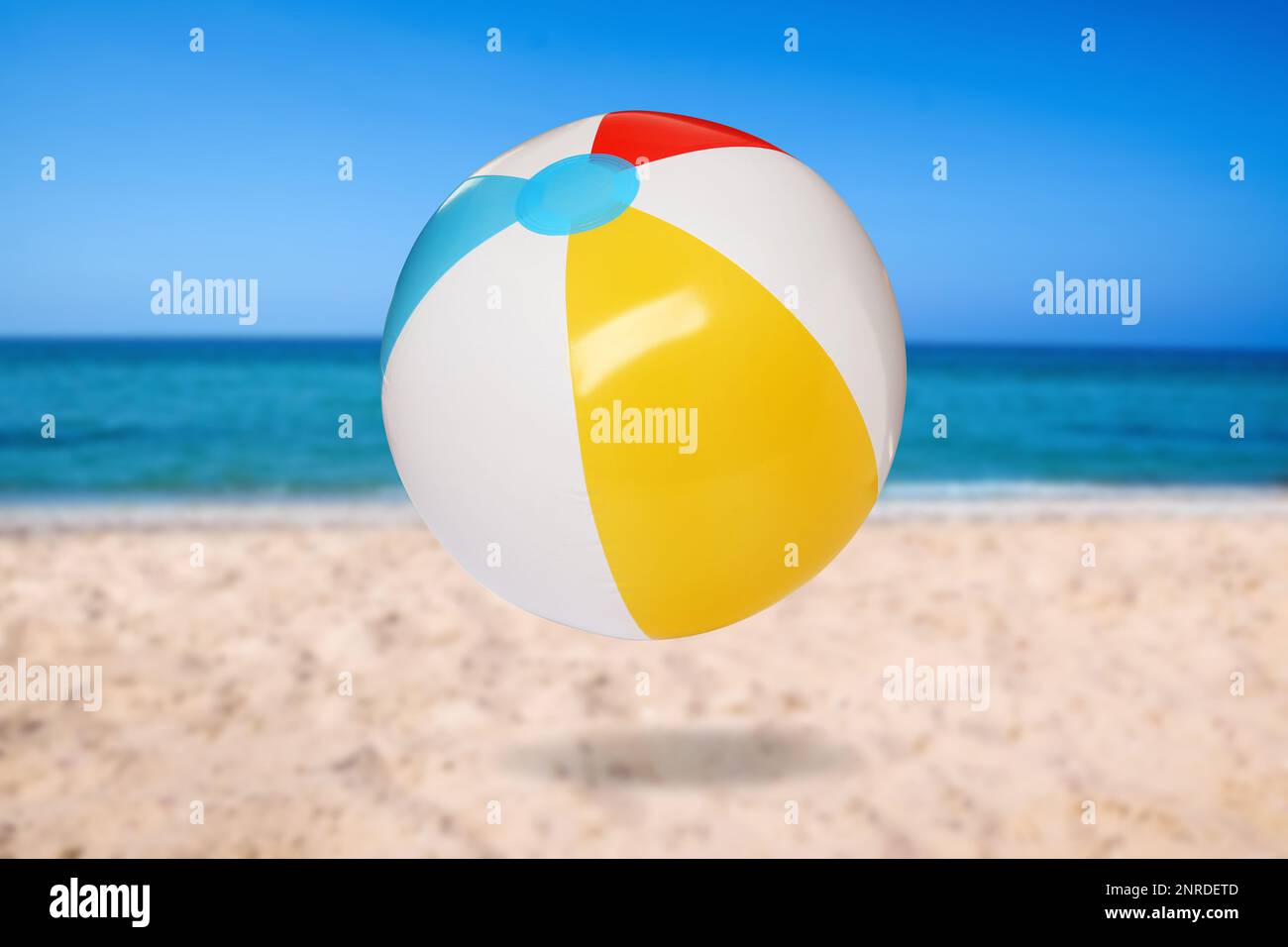 Colorful inflatable beach ball and seascape on background Stock Photo ...
