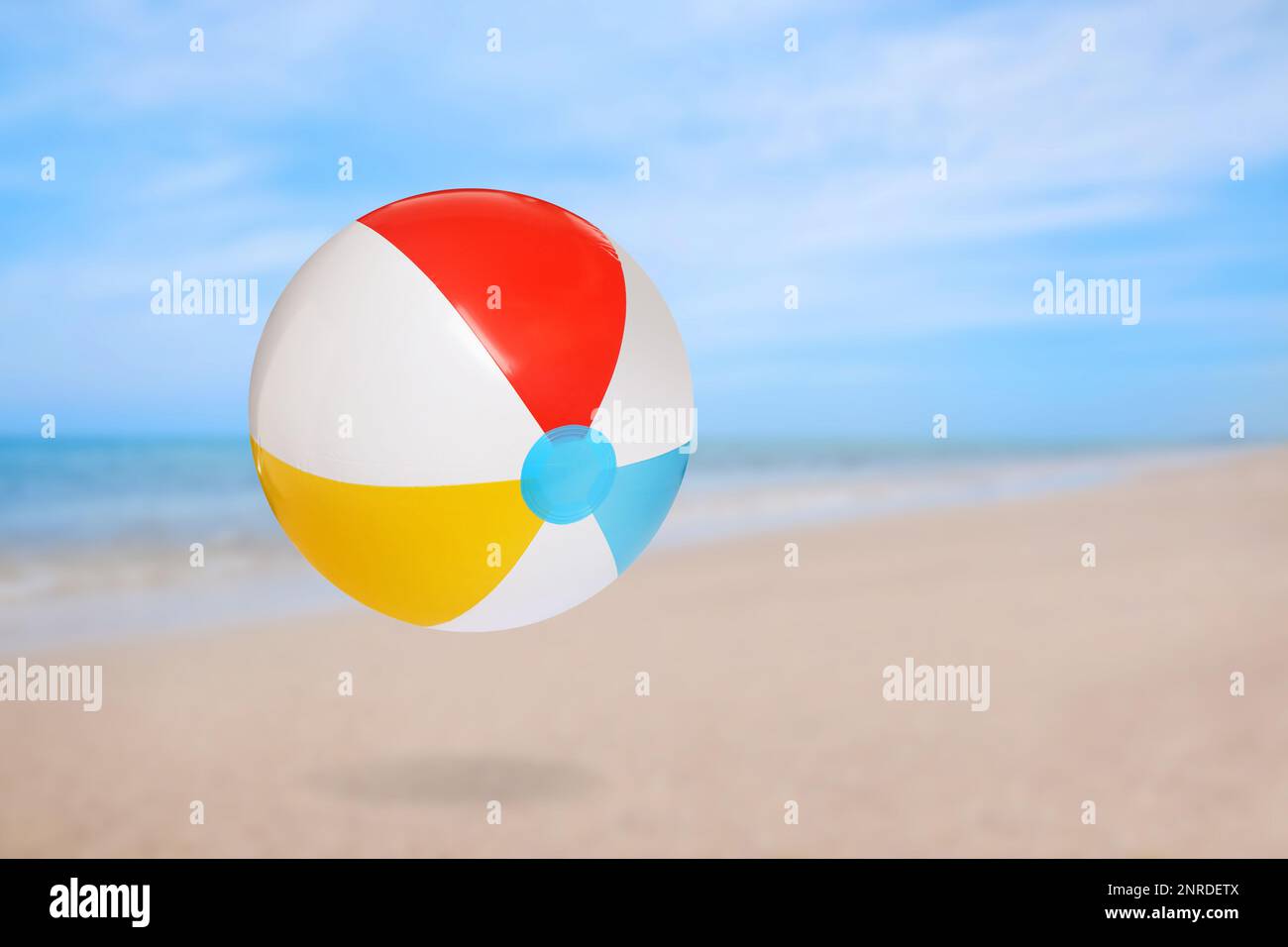 Colorful inflatable beach ball and seascape on background Stock Photo ...