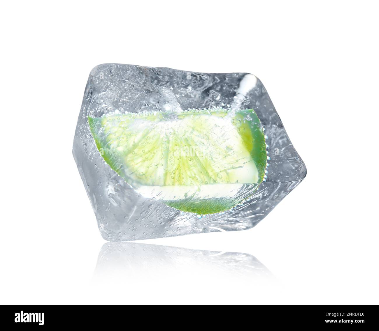 Slice of lime frozen in ice isolated on white Stock Photo - Alamy