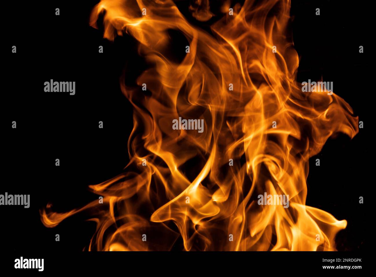 A blazing fire against a black background Stock Photo - Alamy