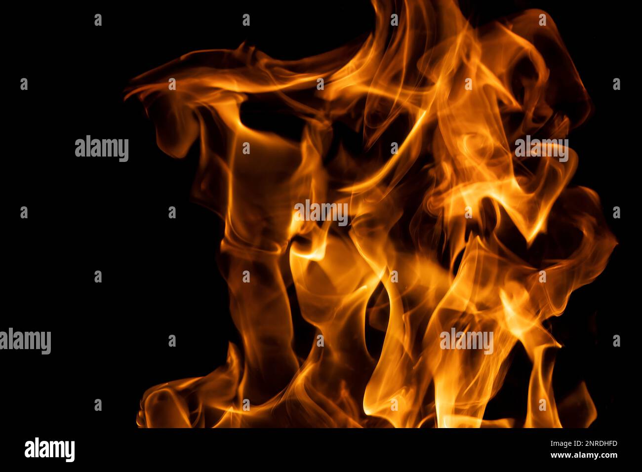 A fire in the dark with some flames Stock Photo - Alamy