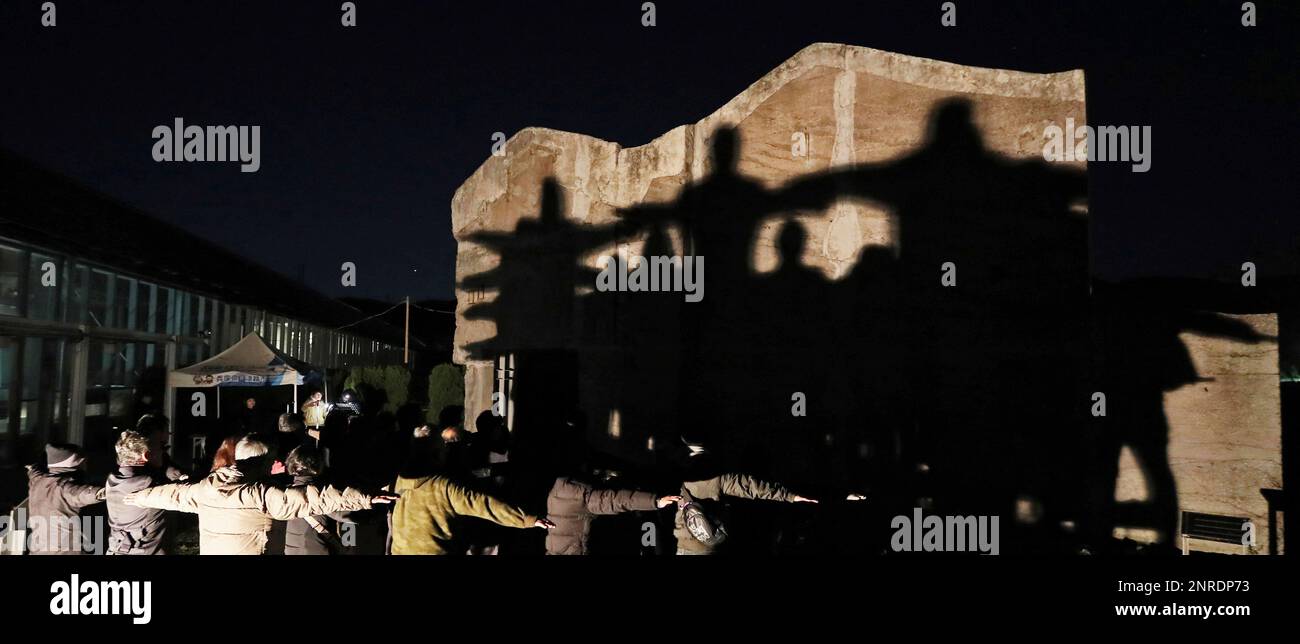 "Kobe Wall" lit up to show the cross by participants' shadows prior to ...