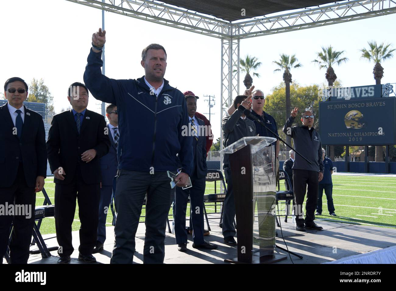 St. John Bosco Braves coach Jason Negro (second from left) stands ...