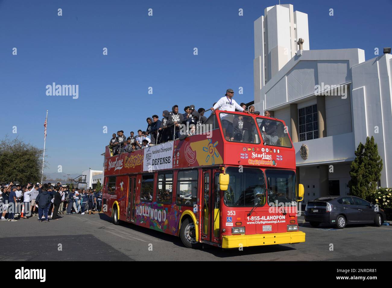 Members of the St. John Bosco Braves football team arrive to campus ...