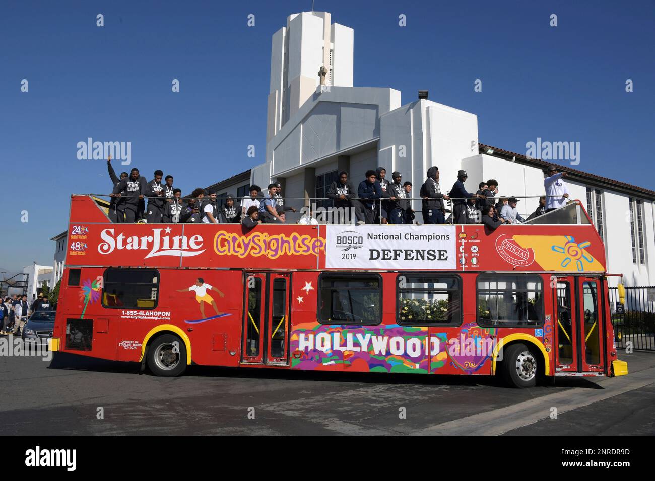Members of the St. John Bosco Braves football team arrive to campus ...