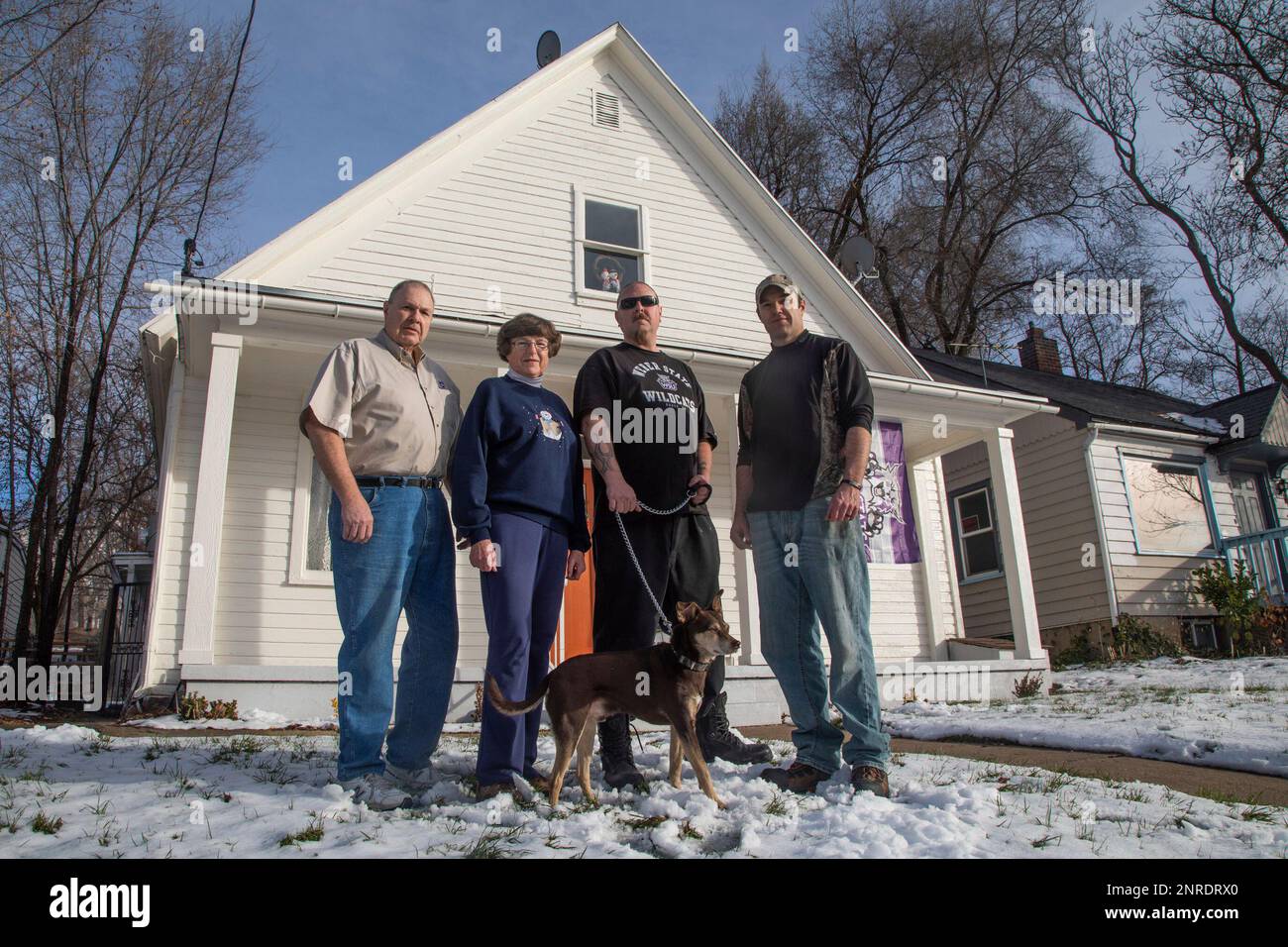 The Boothe family pose for a portrait in front their home on Friday ...