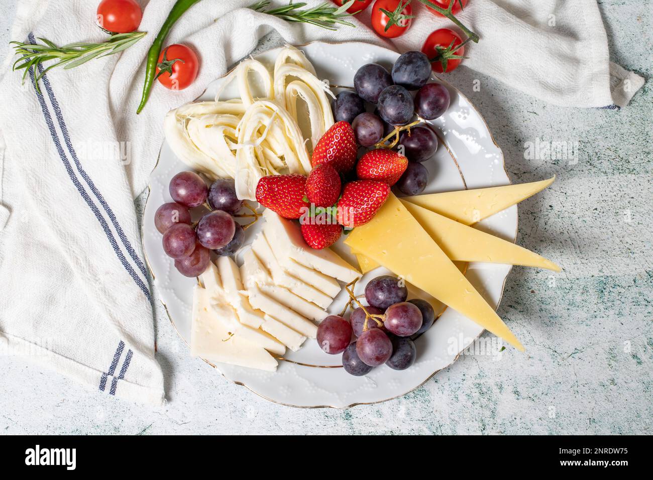 Cold cheese plate, cheese set platter. Strawberry, grape and cheese ...