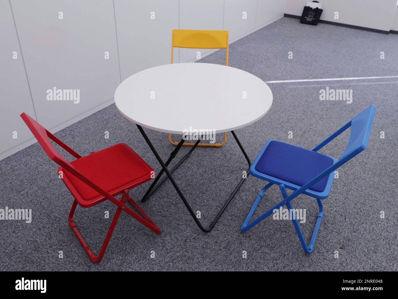A table and chairs that will be used at Olympic Village during Tokyo ...
