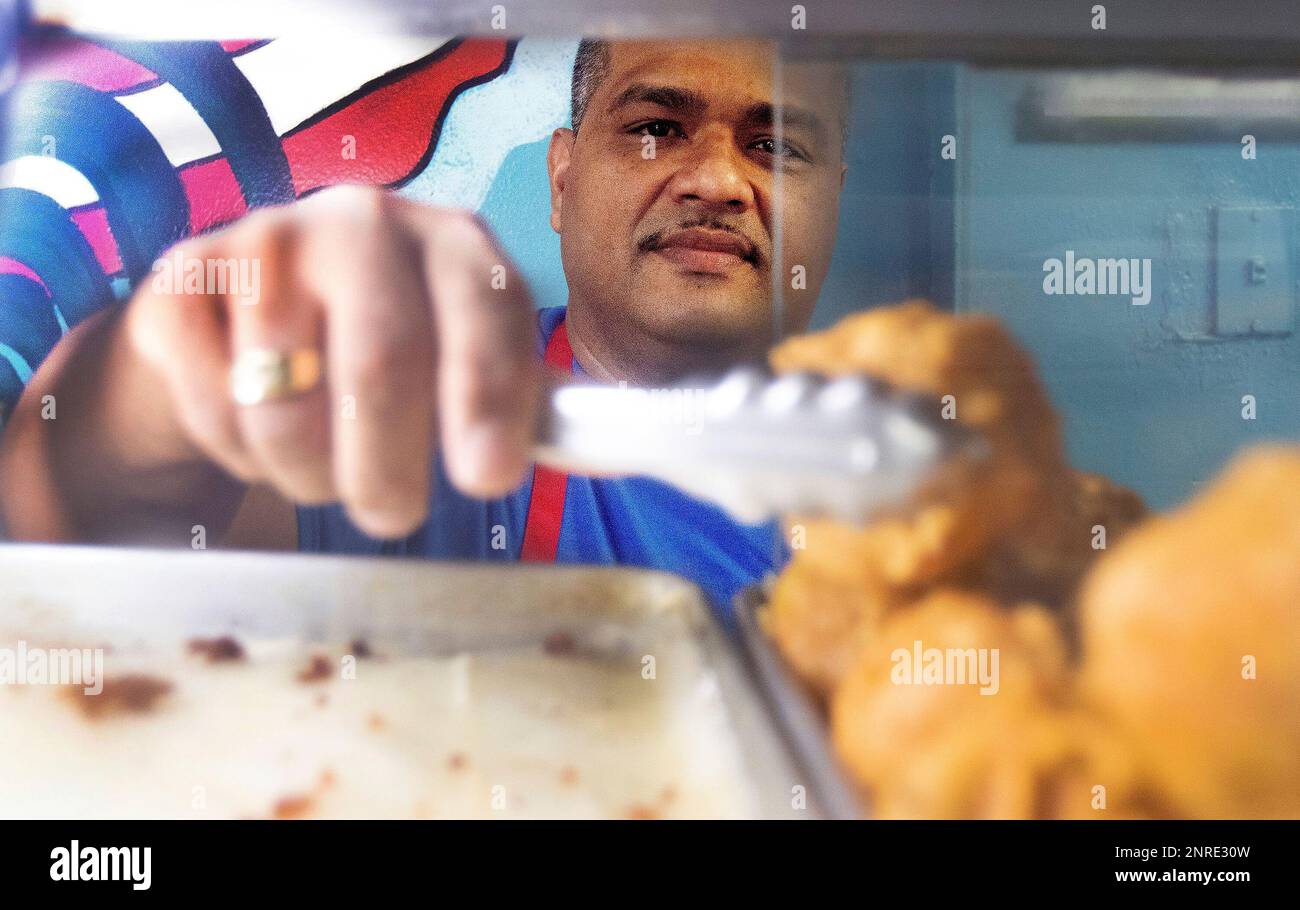 This Dec. 27, 2019 photo shows Pedro Ocasio, owner, serves empanada at ...