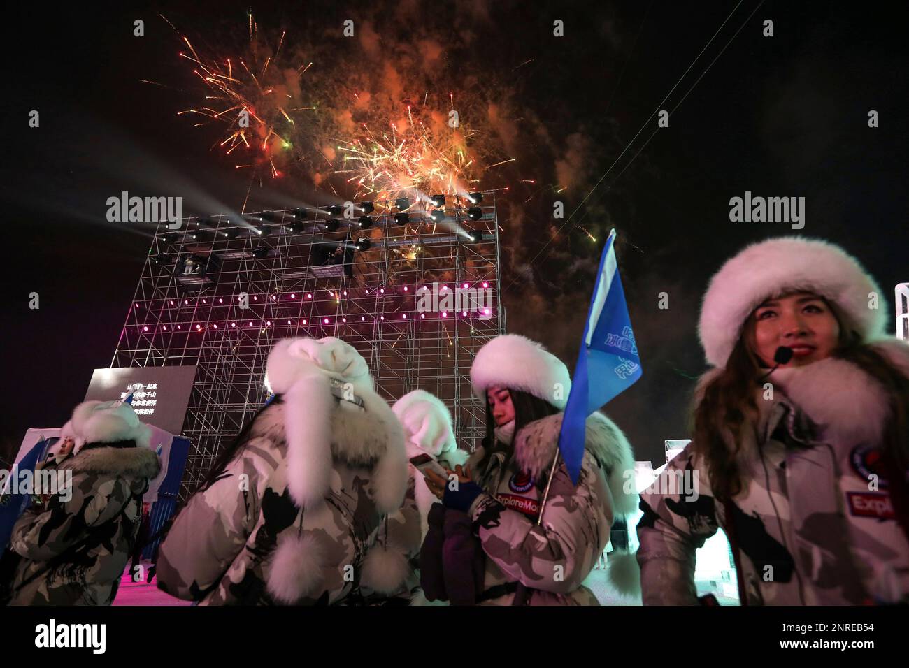 People gather as fireworks explode during a ceremony on the opening ...