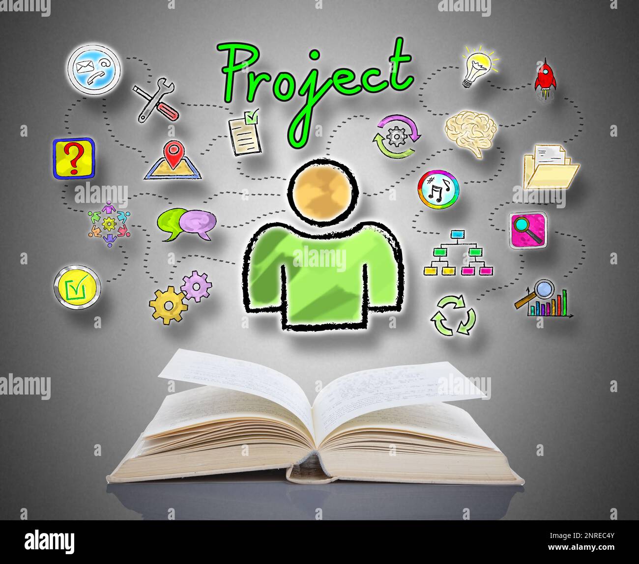 Project concept above an open book Stock Photo - Alamy