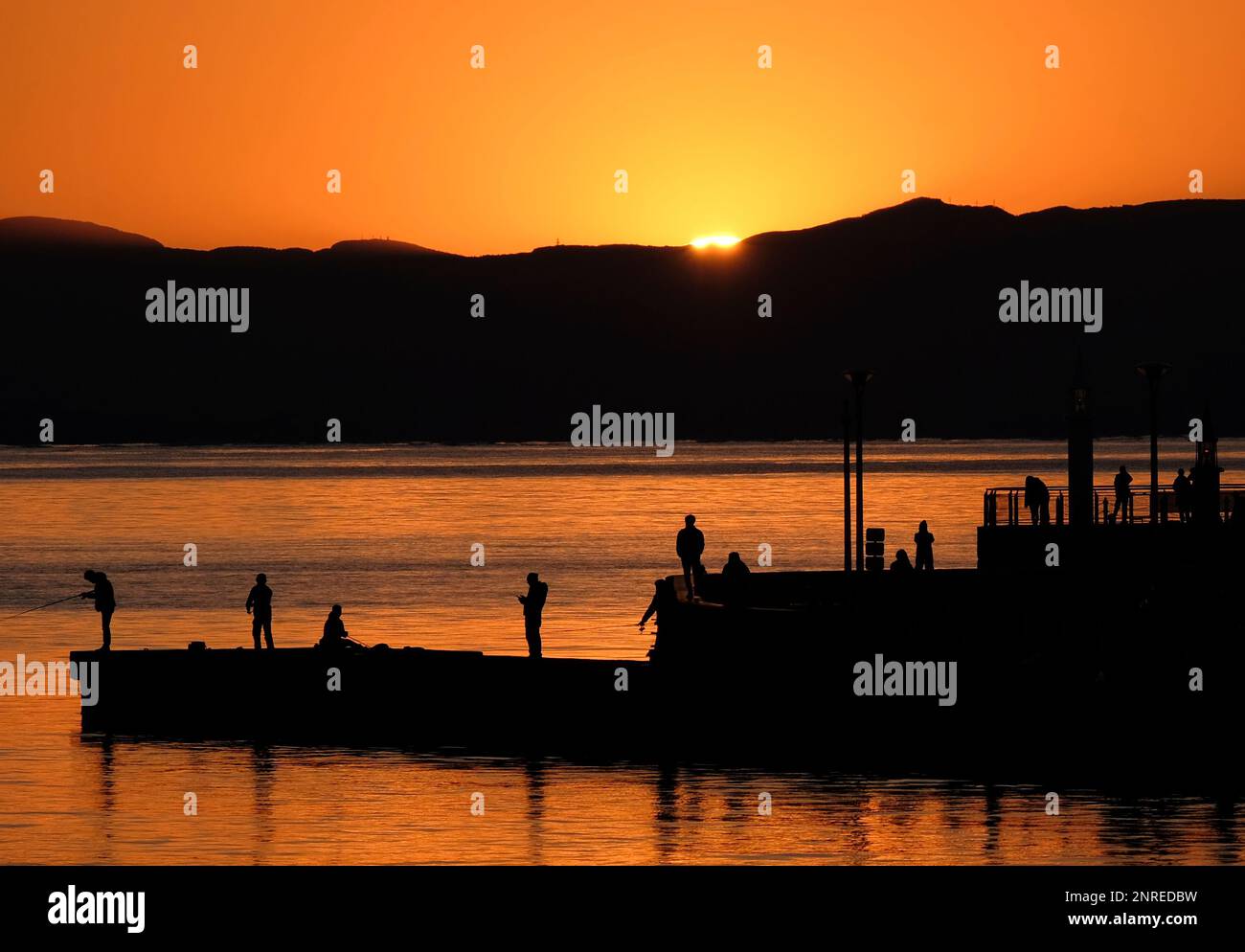The setting sun coloring the sky over Enoshima, Japan Stock Photo - Alamy
