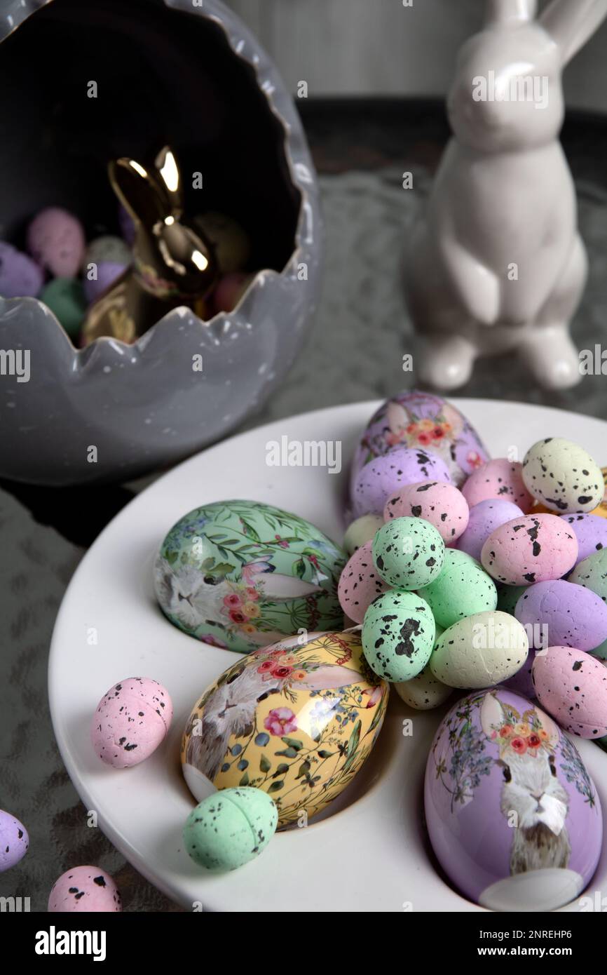 photo of a rabbit sitting in an egg with small eggs inside a large ...