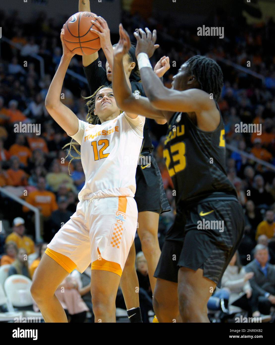 Tennessee's Rae Burrell (12) scores a layup between Missouri's Jordan ...