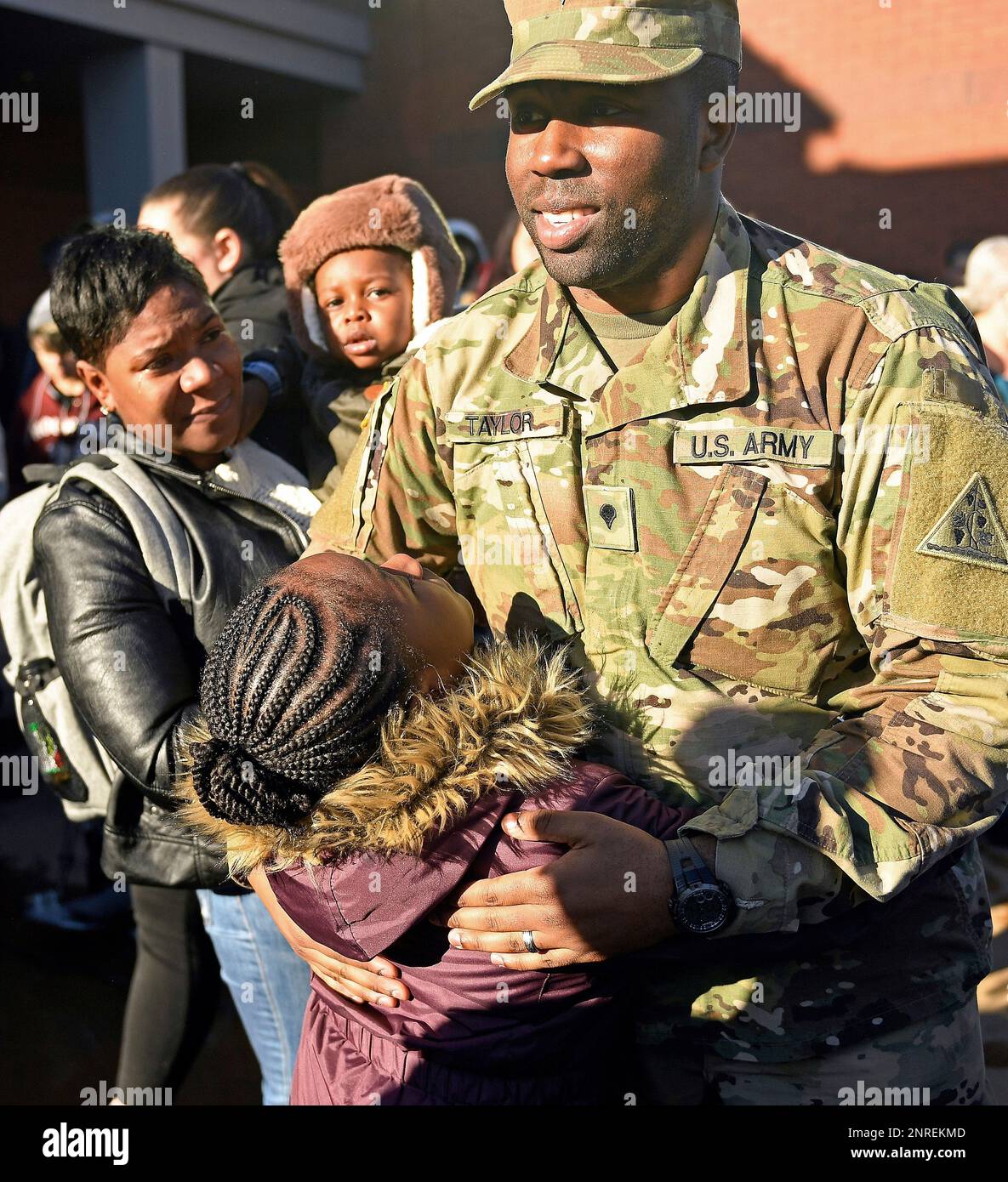 Connecticut Army National Guard Specialist Tyrone Taylor embraces his ...